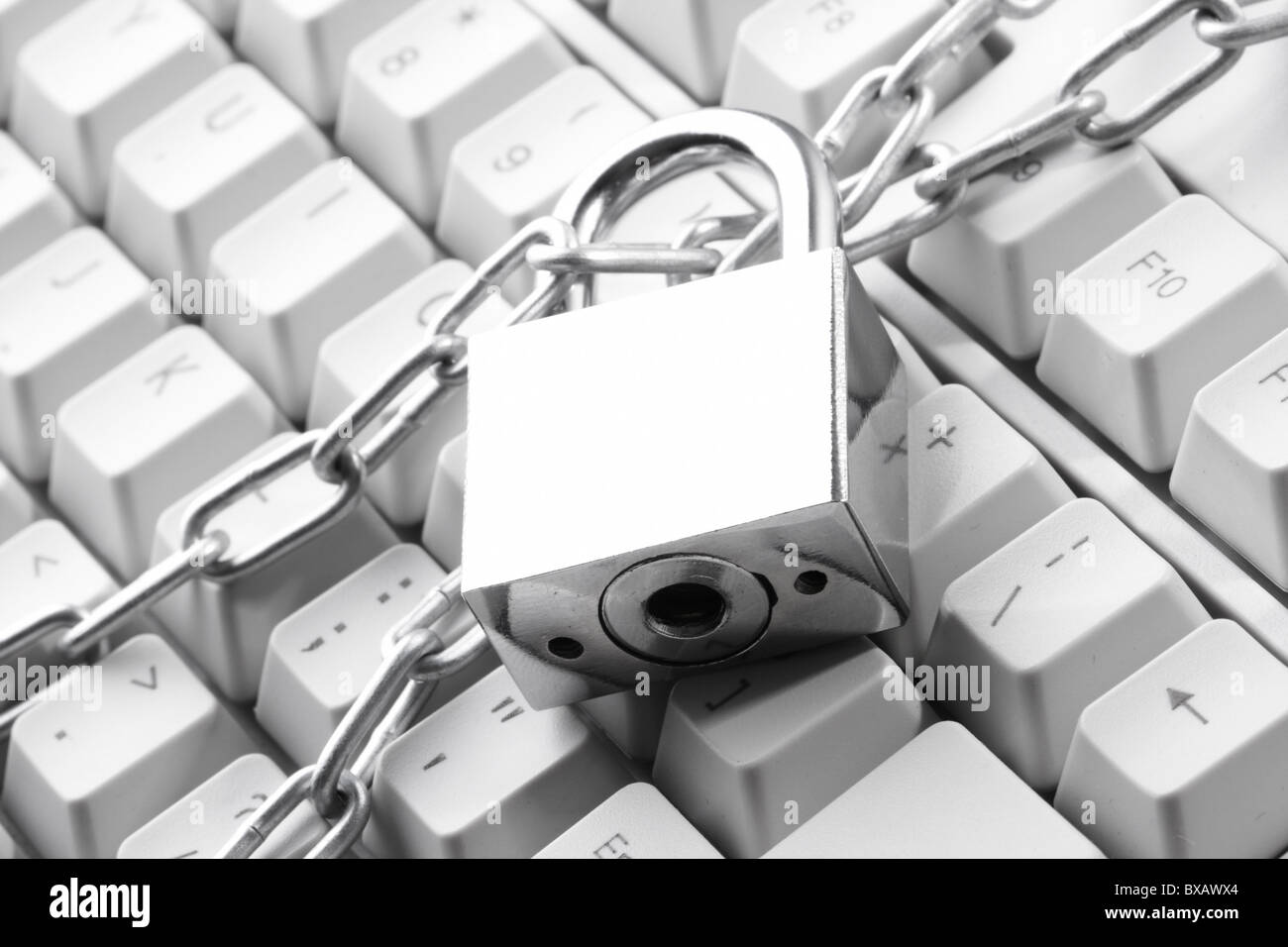 Computer keyboard secured with chain and padlock Stock Photo - Alamy