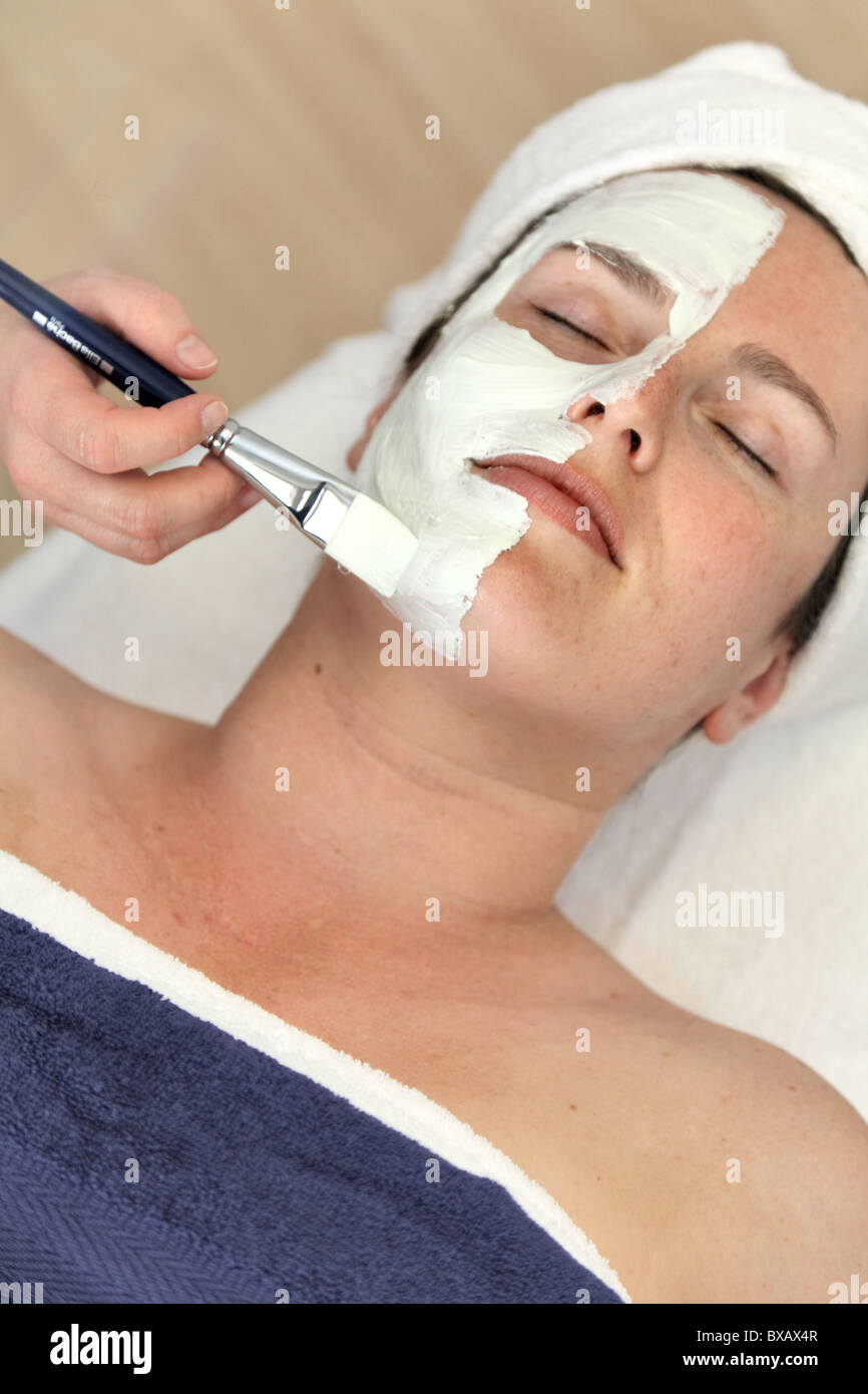 Woman with a facial mask Stock Photo - Alamy