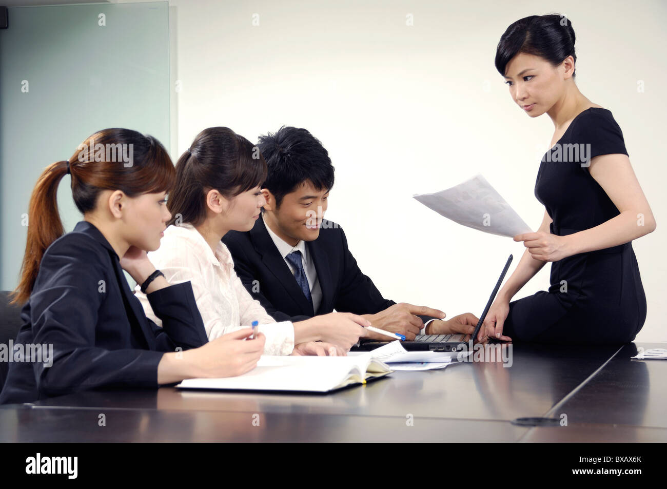 Business executives discussing in a conference room Stock Photo - Alamy