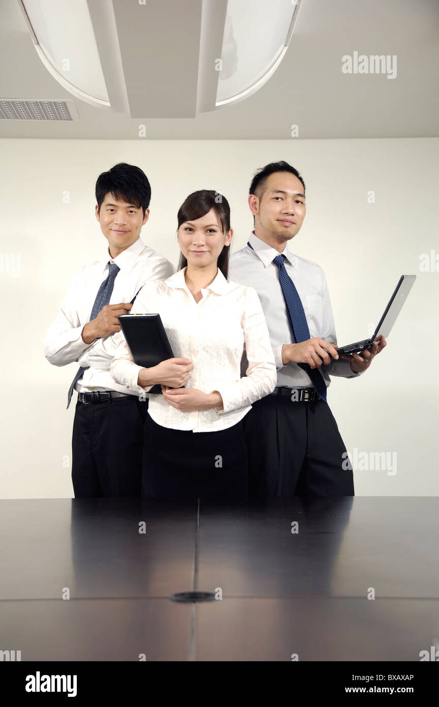 Business executives standing in a conference room Stock Photo - Alamy