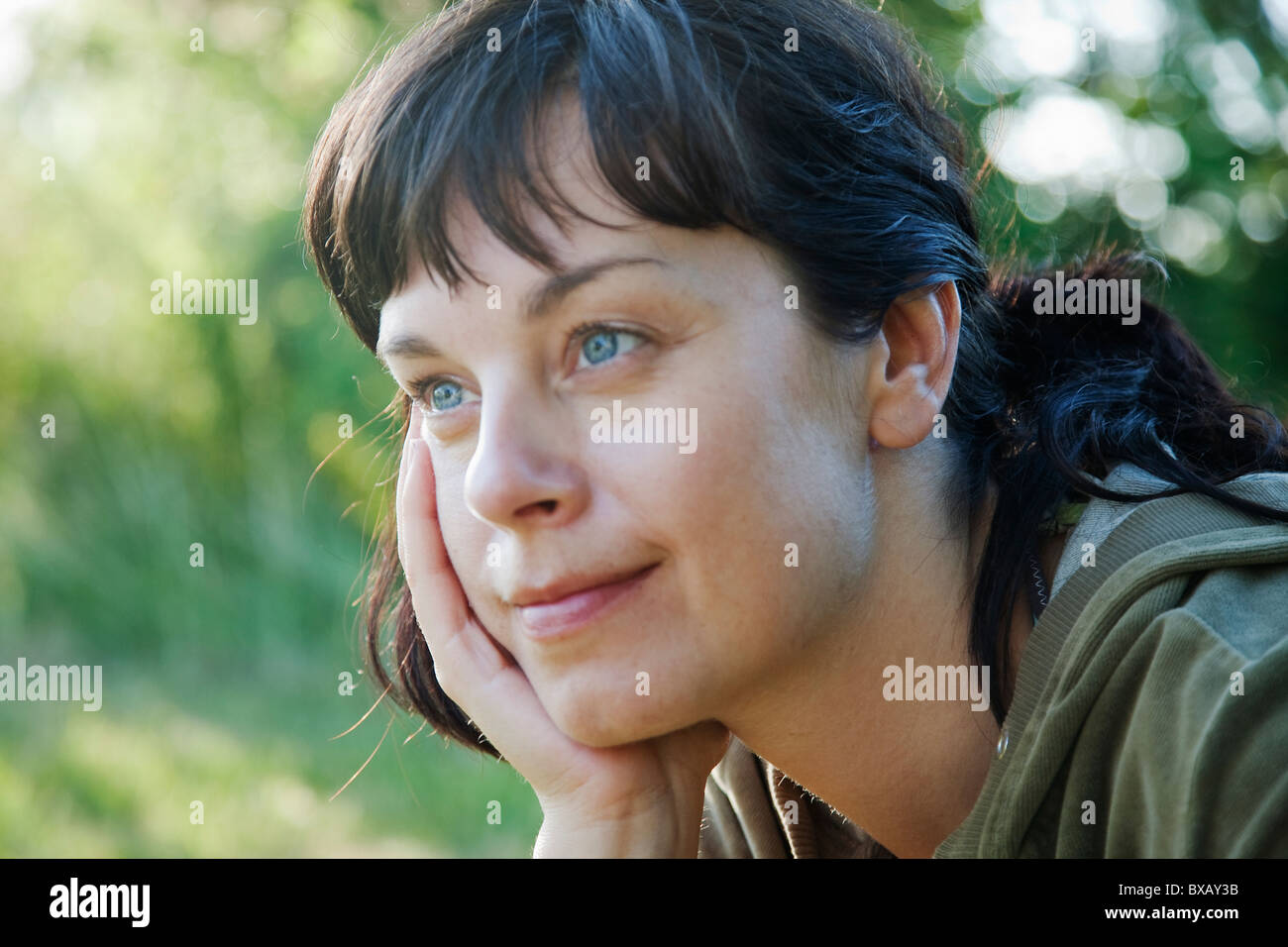 Smiling looking away hi-res stock photography and images - Alamy