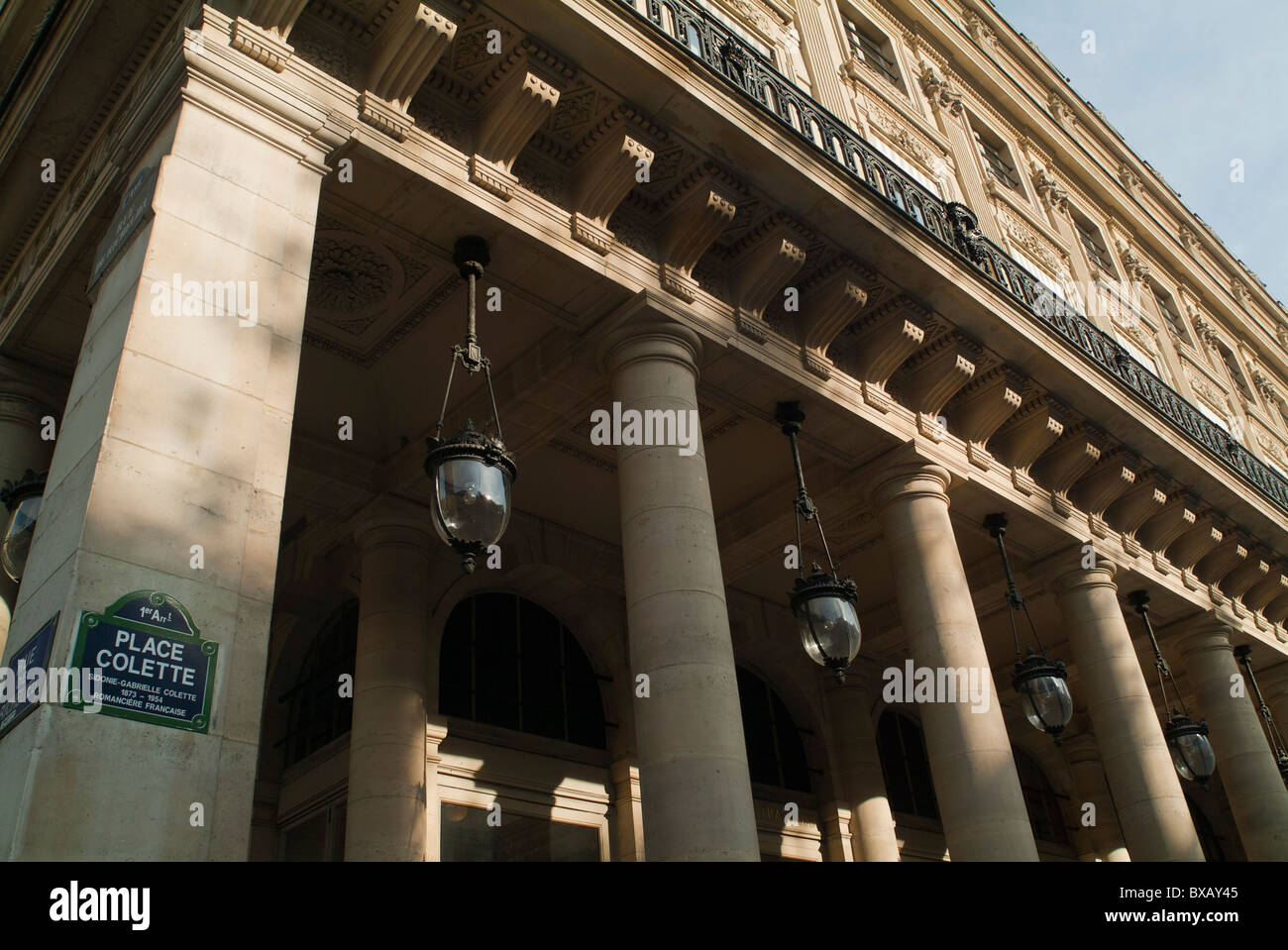 Streetlamps and columns outside a building on the Place Colette, Paris ...