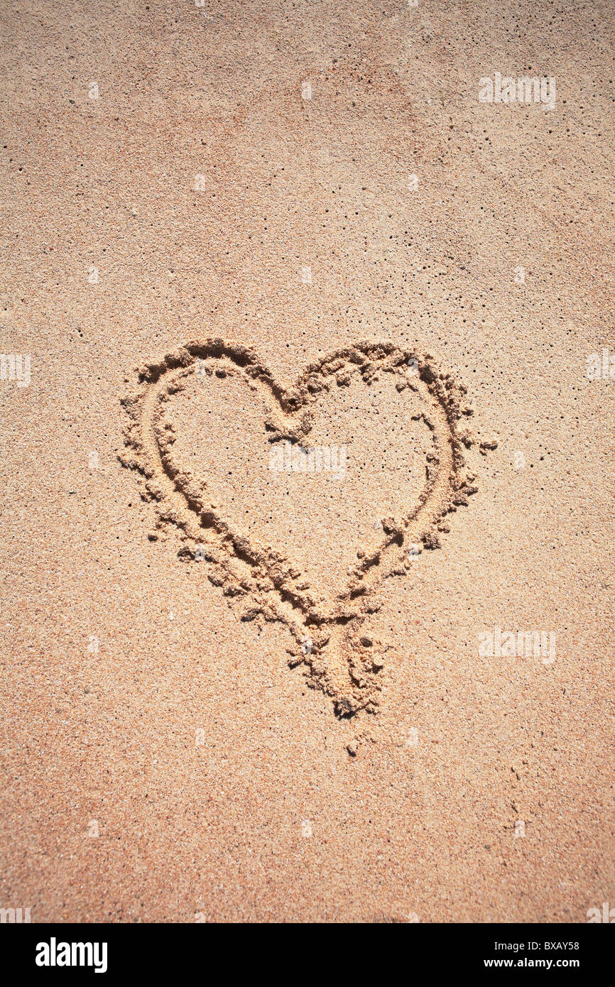 Heart shape on sand Stock Photo - Alamy
