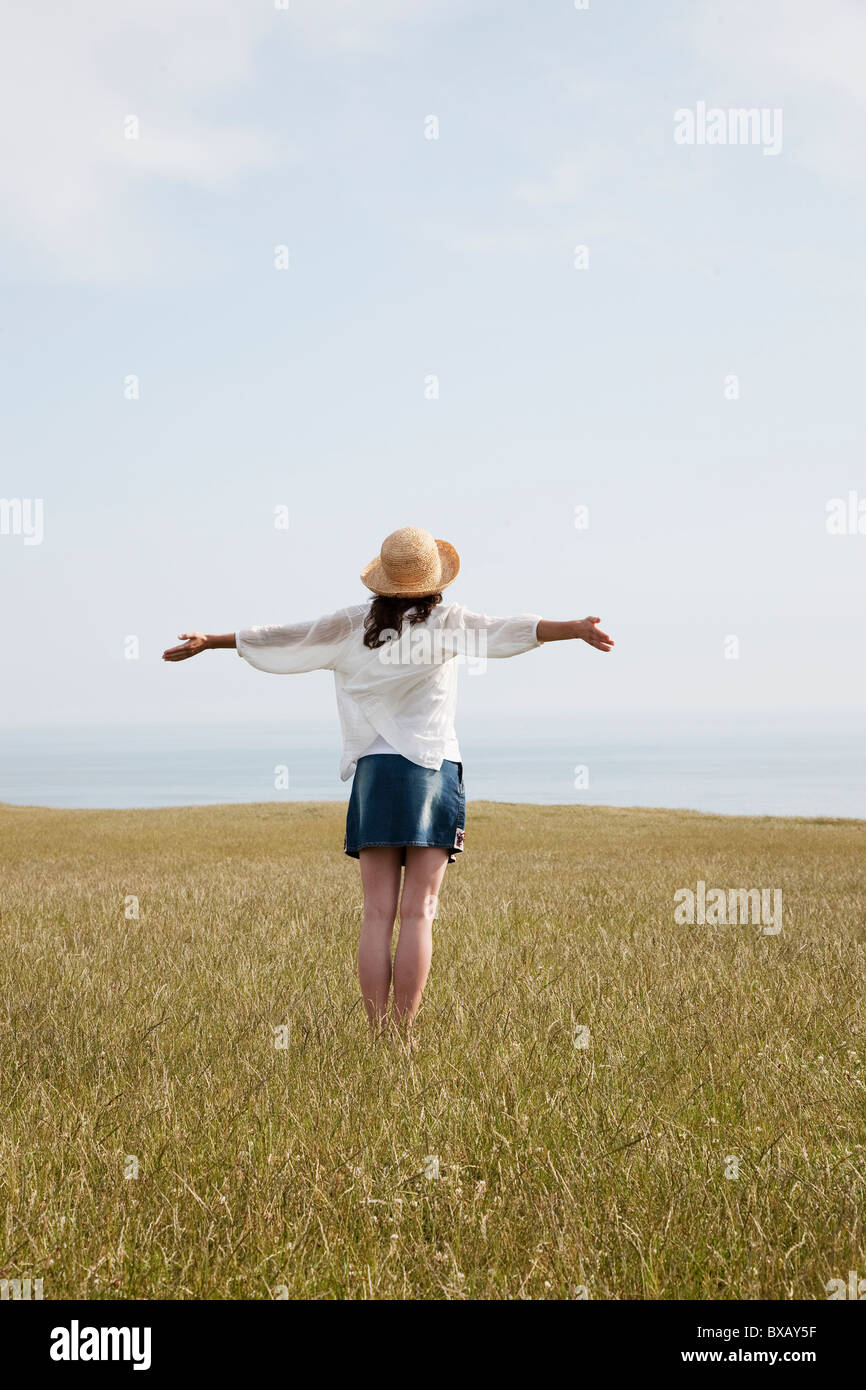 Rear view standing woman hi-res stock photography and images - Alamy