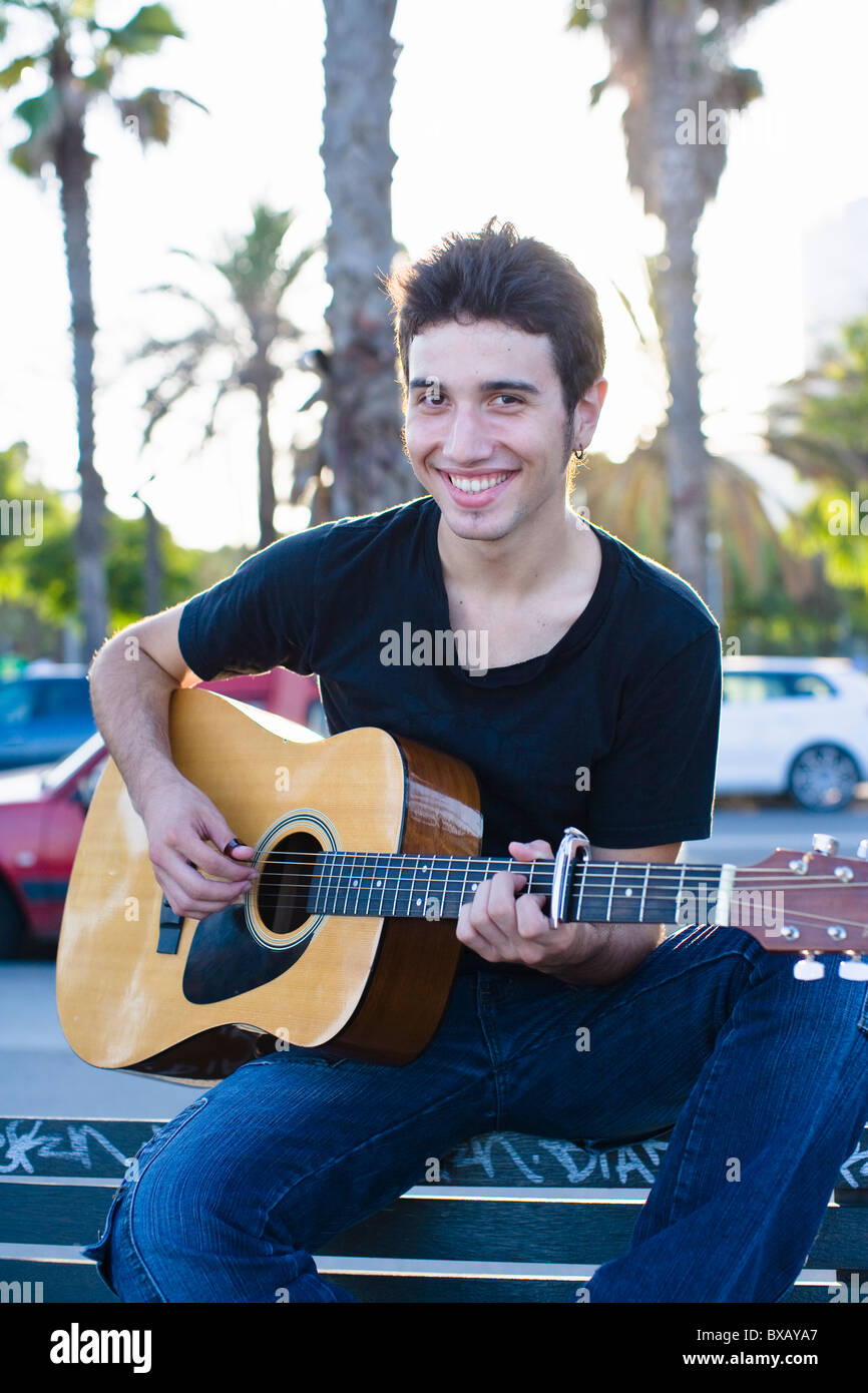 Guitar held hi-res stock photography and images - Alamy