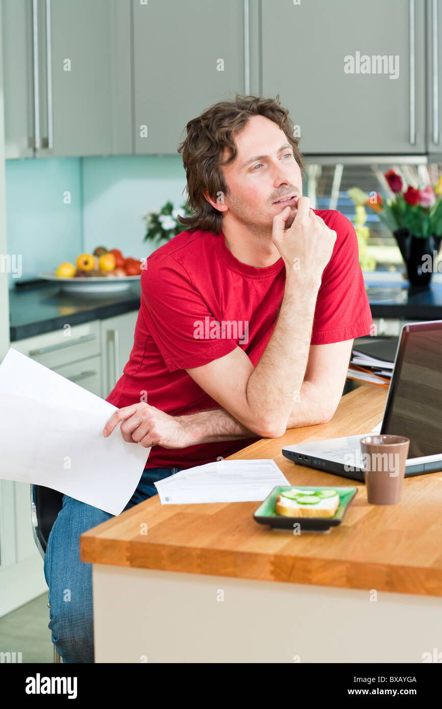 Mid-adult man working from home Stock Photo - Alamy