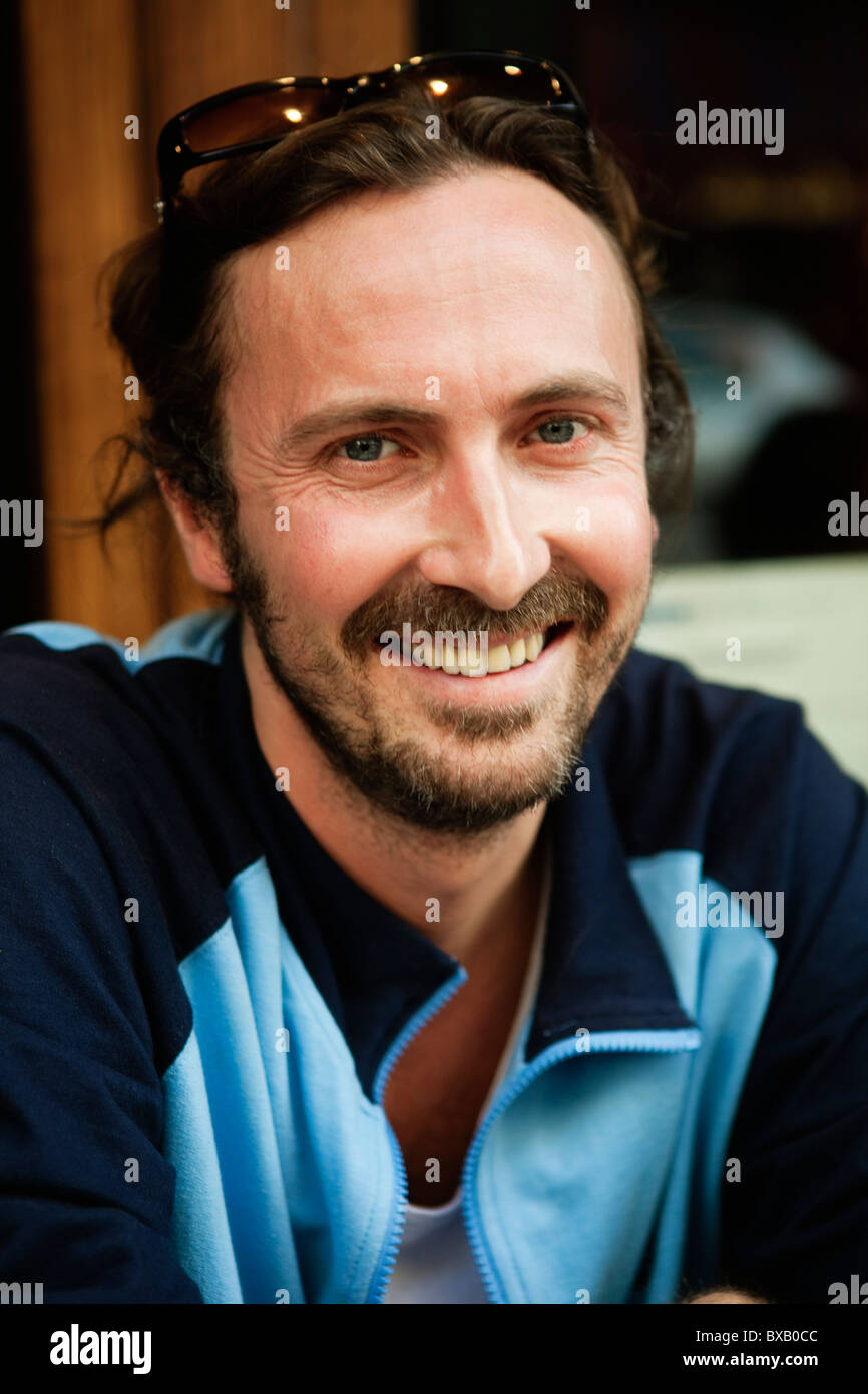 Mid adult man smiling Stock Photo - Alamy
