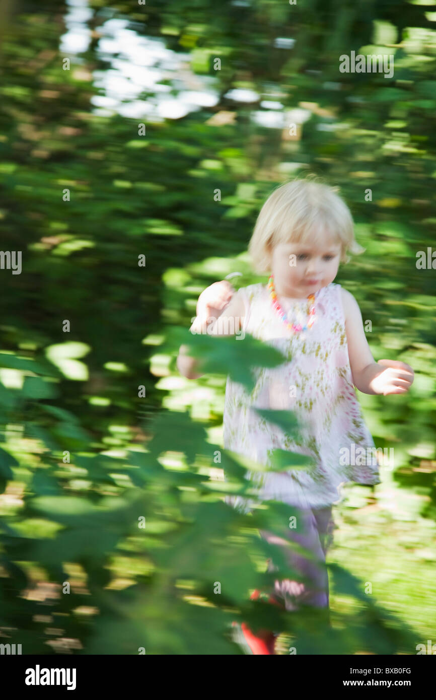 Girl running in forest Stock Photo - Alamy