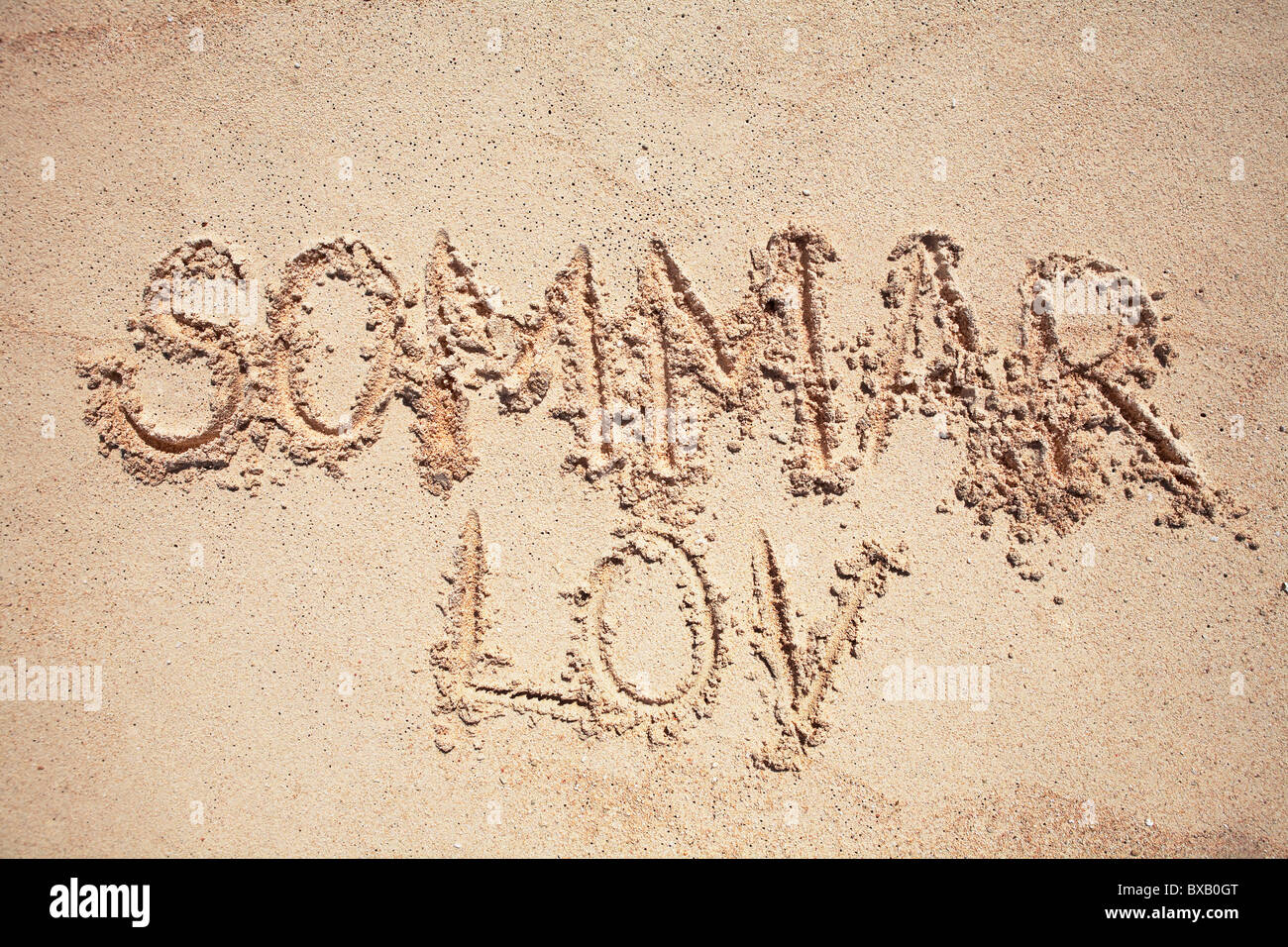 Text written on sand Stock Photo - Alamy