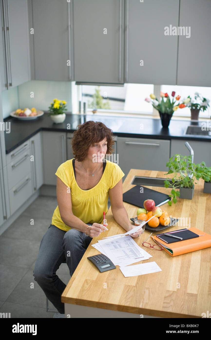 Woman light hair sitting kitchen hi-res stock photography and images ...
