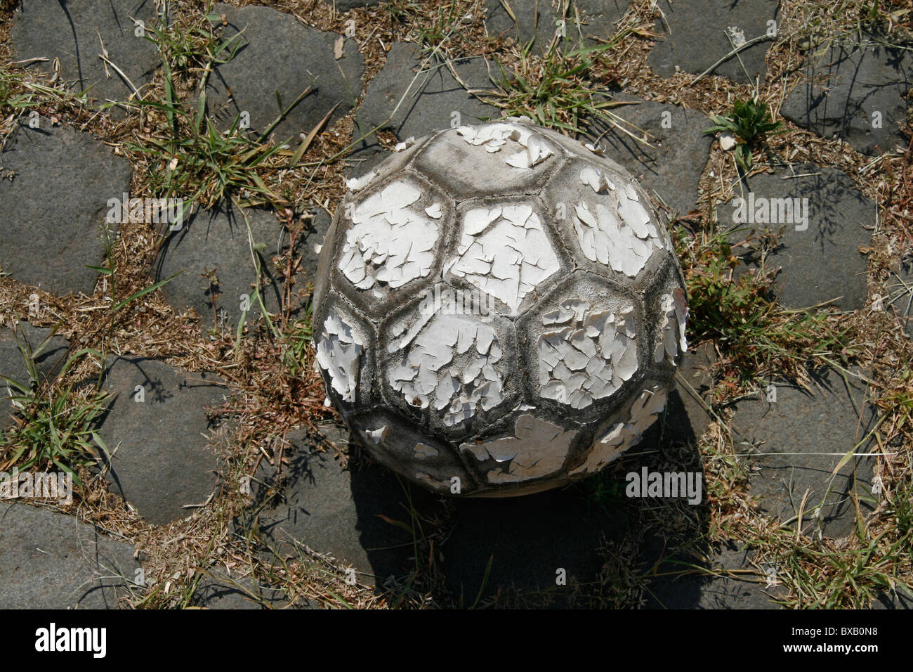 one old damaged football in field Stock Photo - Alamy