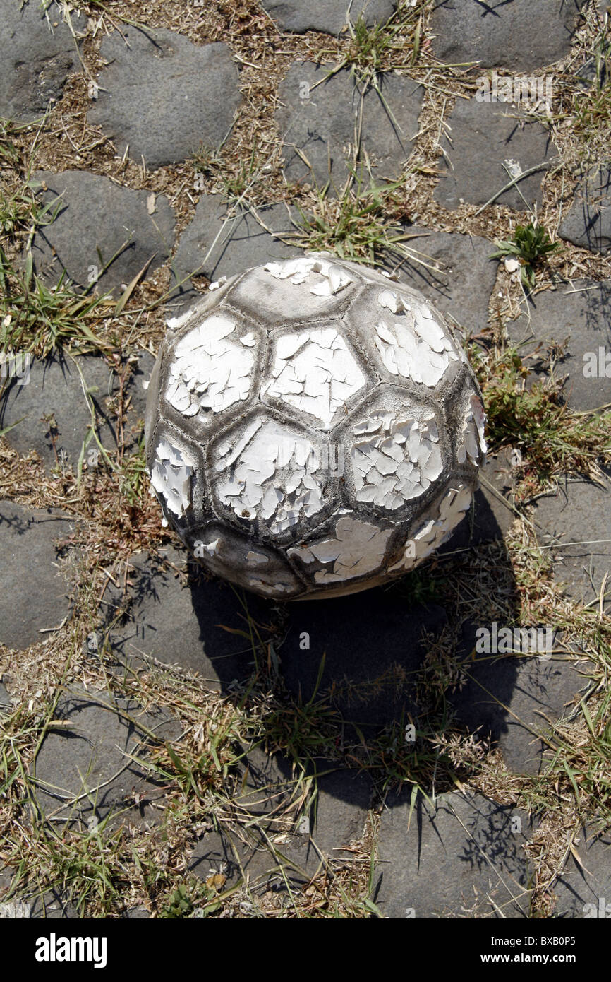 one old damaged football in field Stock Photo - Alamy