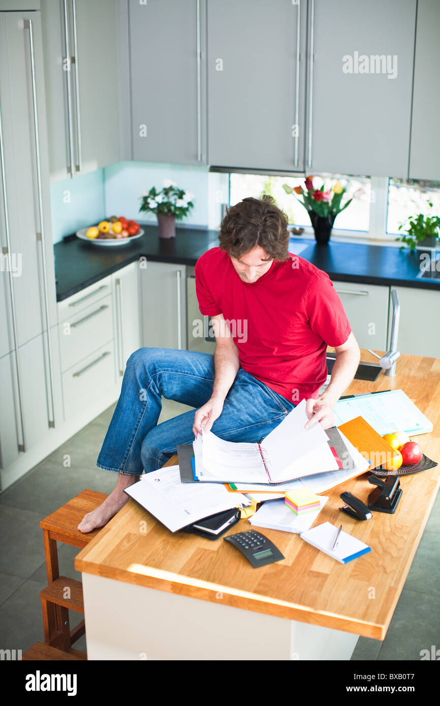Mid adult man working from home Stock Photo - Alamy