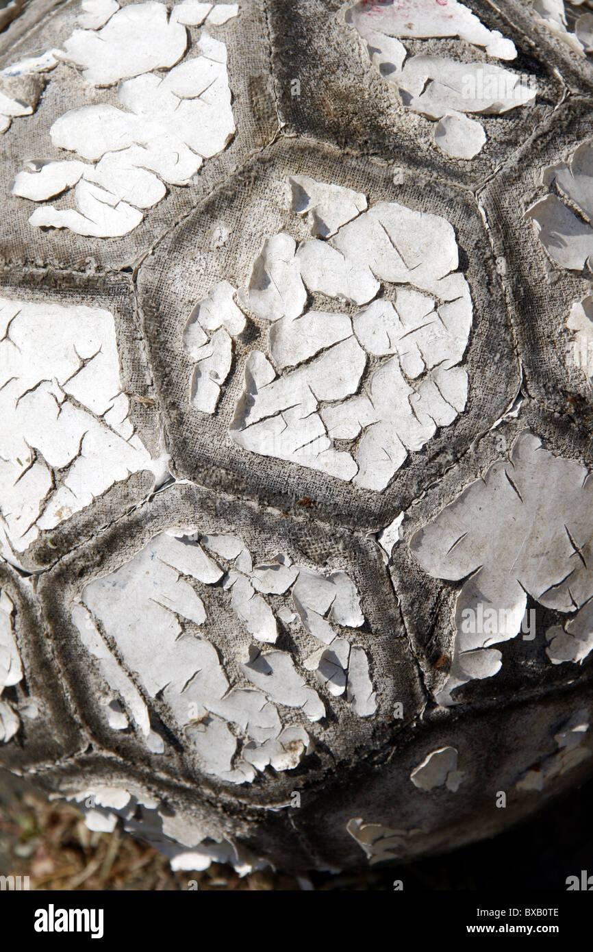 one old damaged football in field Stock Photo - Alamy