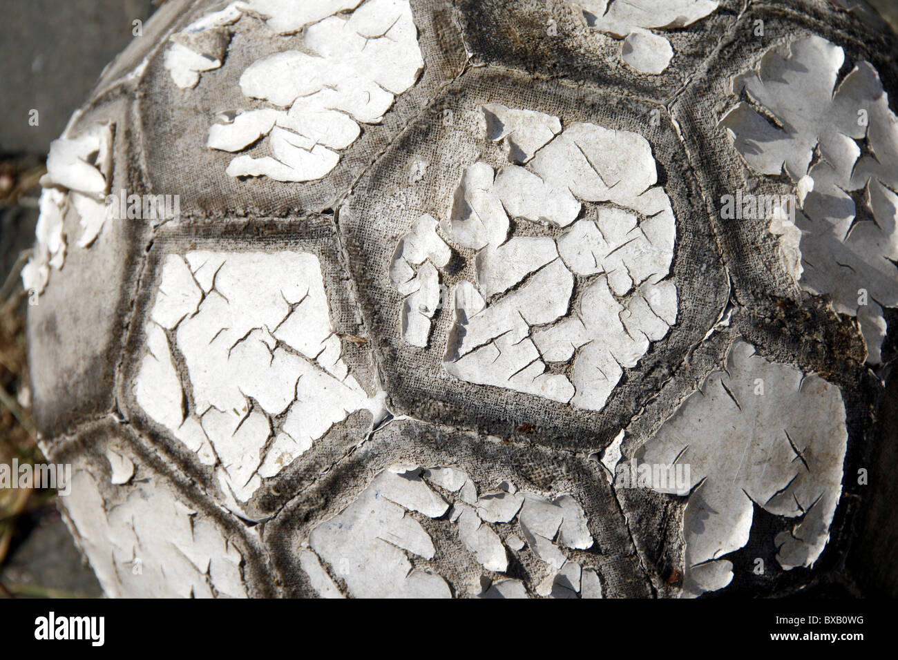 one old damaged football in field Stock Photo - Alamy