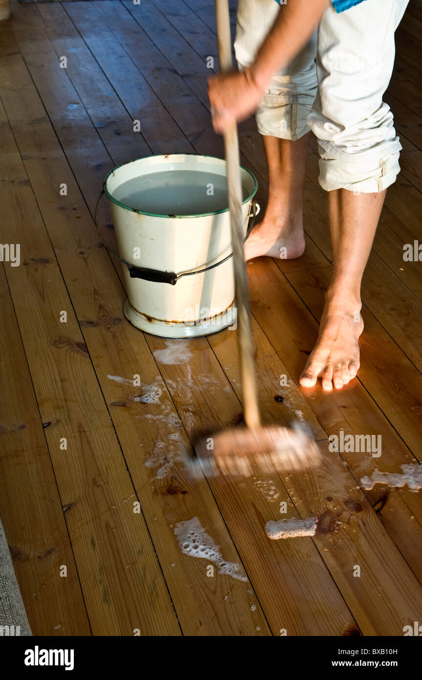 Low section of man mopping floor Stock Photo - Alamy