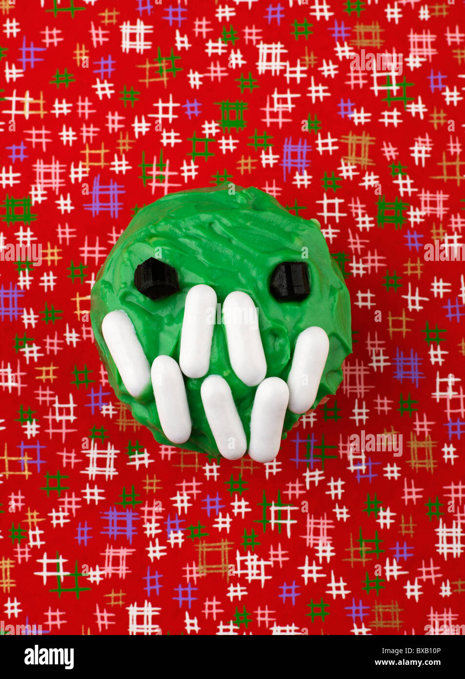 Cake with face on patterned background Stock Photo - Alamy