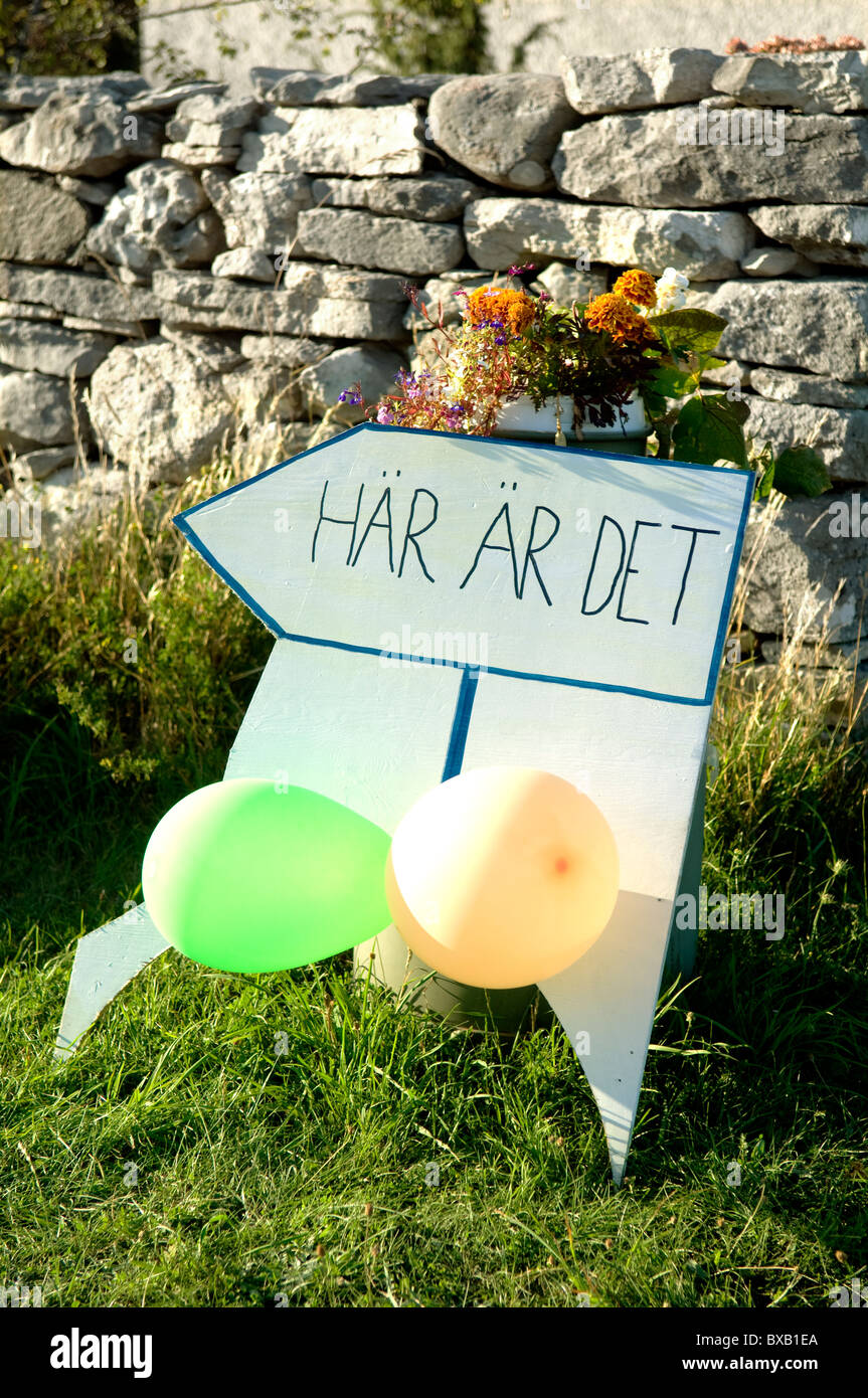 Sign with balloons Stock Photo - Alamy