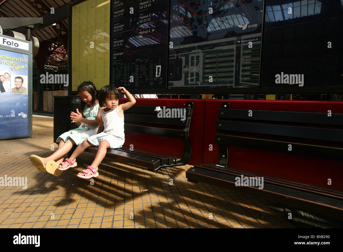 busy passenger in the copenhagen central train station / slow shutter ...