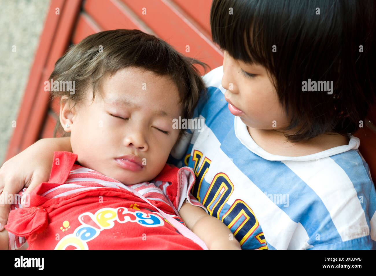 child with baby, cebu city, philippines Stock Photo - Alamy
