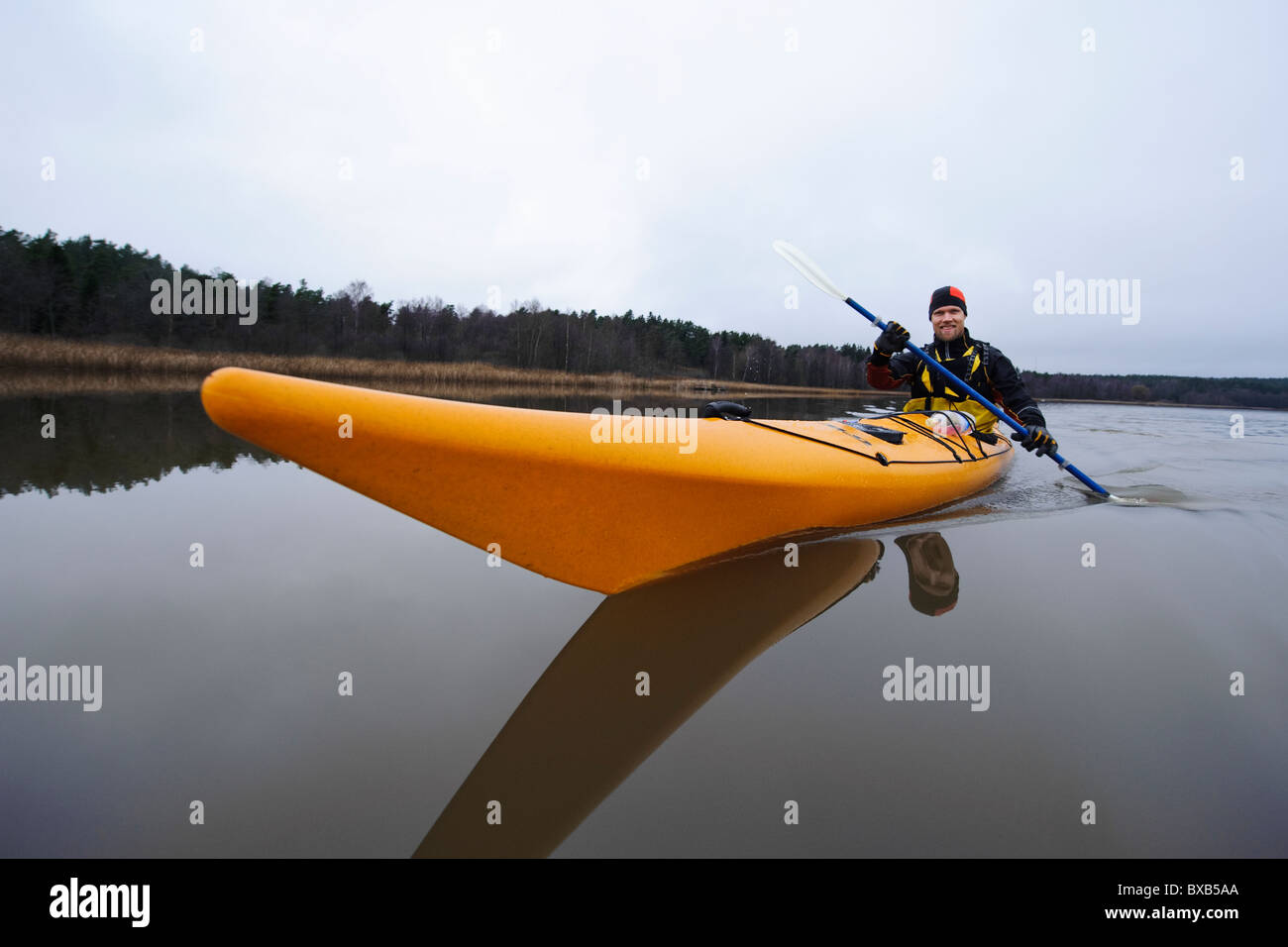 Side view of a man kayaking in rough river Stock Photo - Alamy