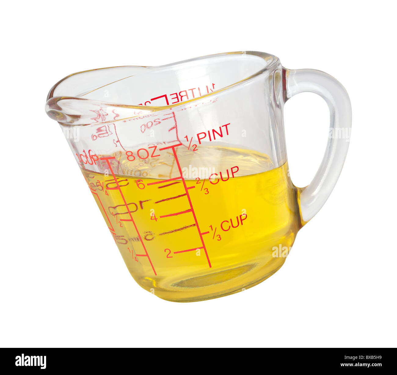 Cooking Oil in Measuring Cup isolated on white Stock Photo - Alamy