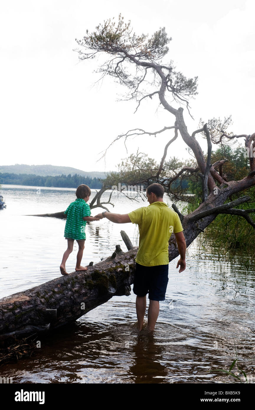 Man walking on laying tree hi-res stock photography and images - Alamy