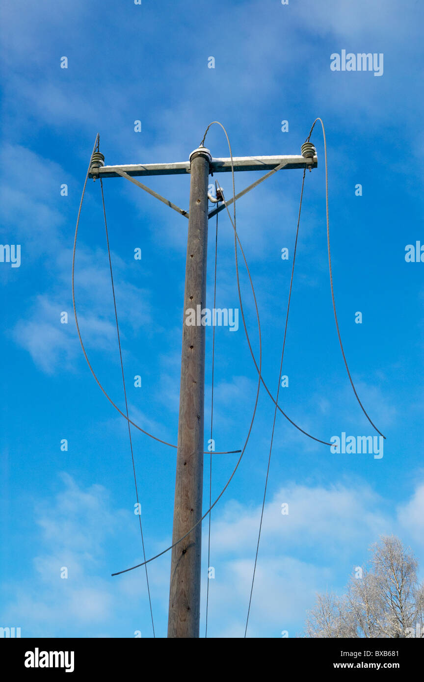 Old electricity pole with broken cables Stock Photo - Alamy