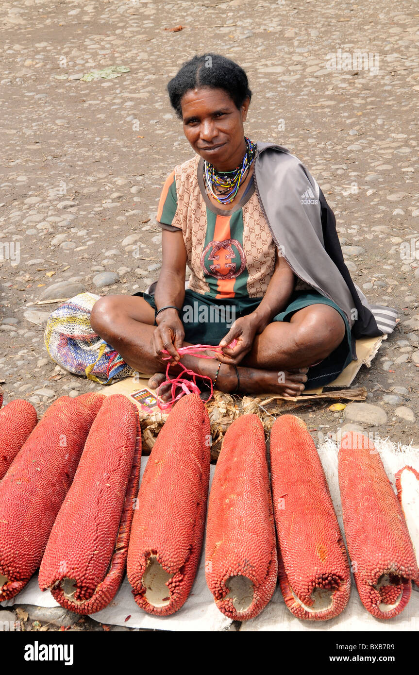 Dani woman selling Panda nuts on the market place of Wamena, Baliem ...