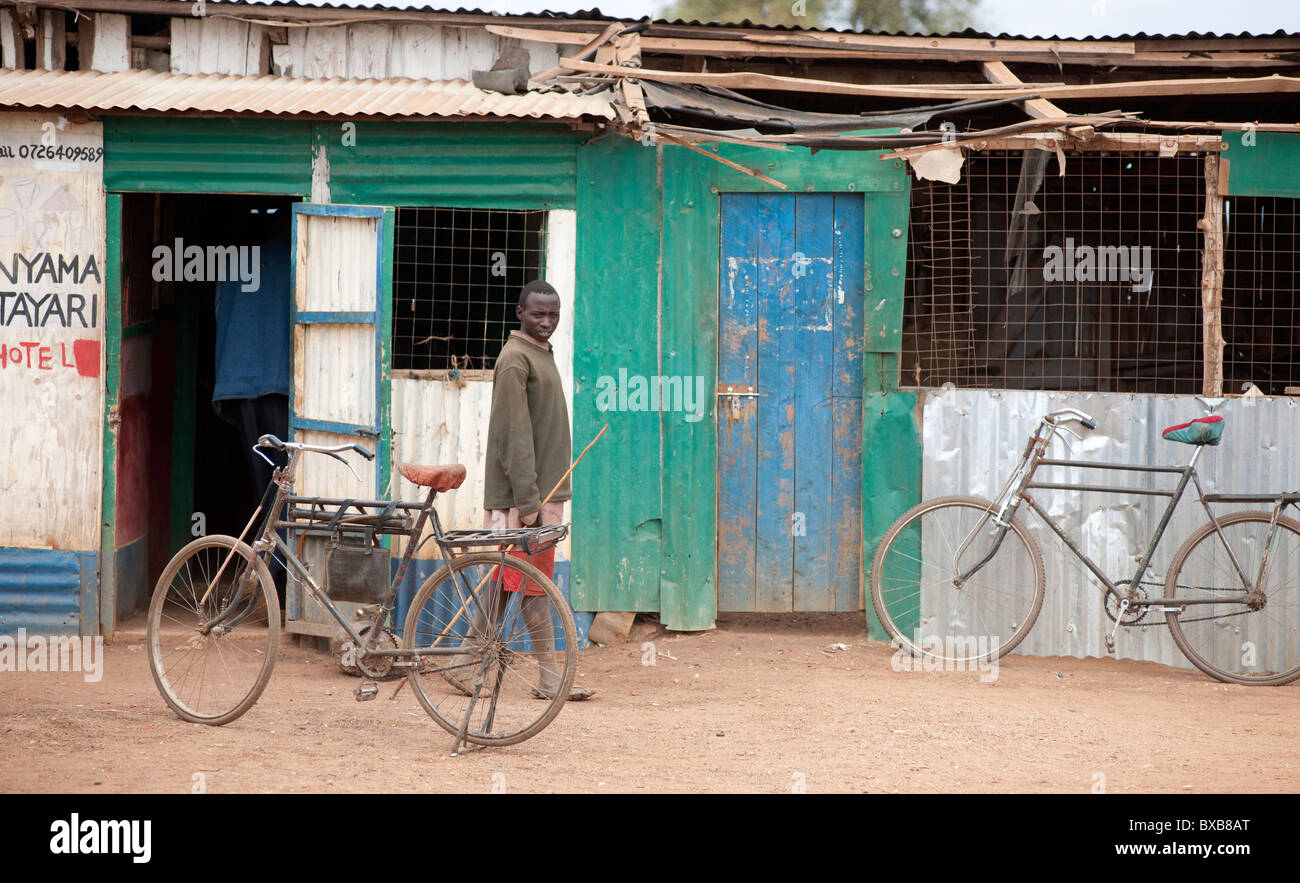 Villager by hut in Kenya Stock Photo - Alamy