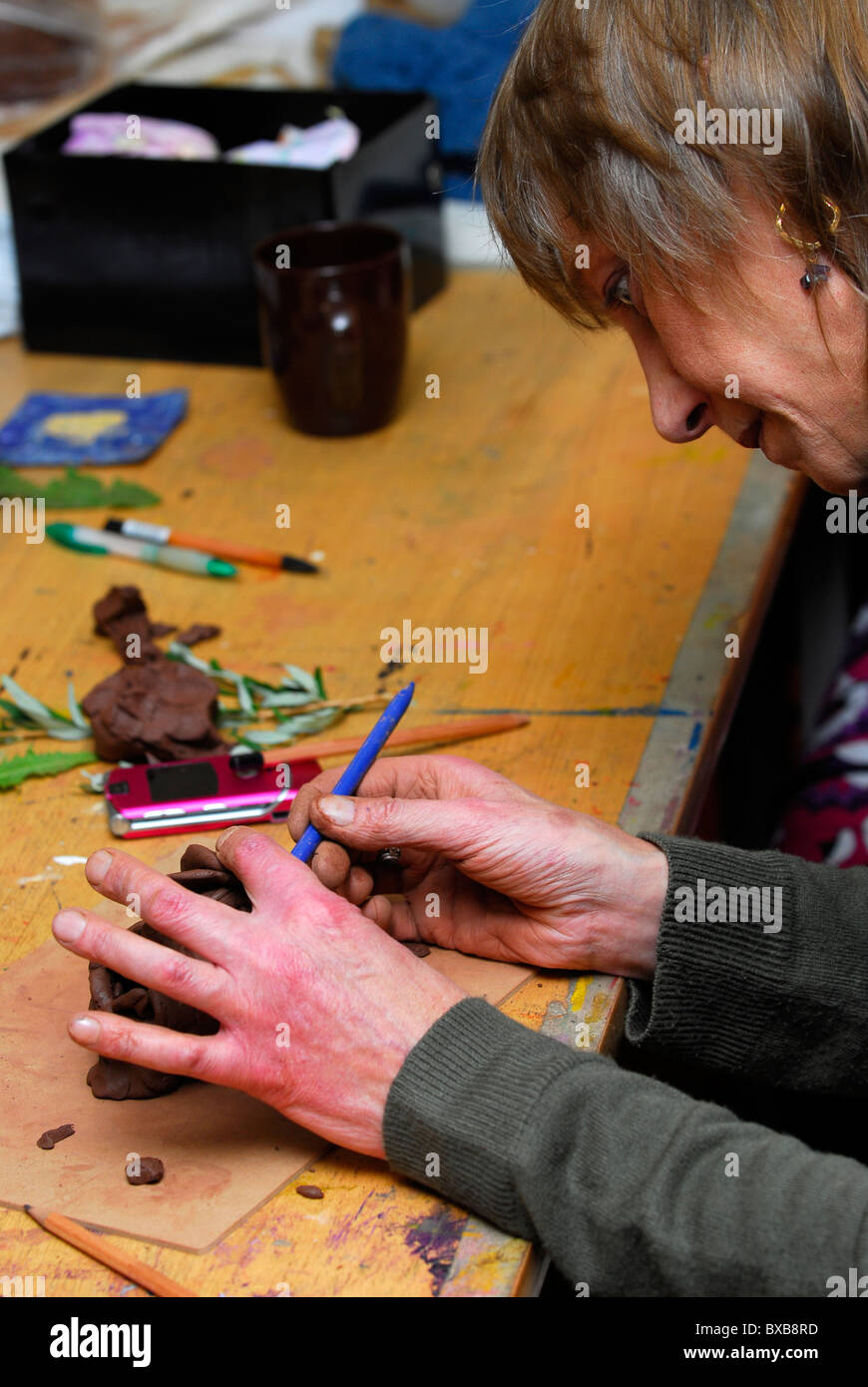 Woman engaged in task hi-res stock photography and images - Alamy