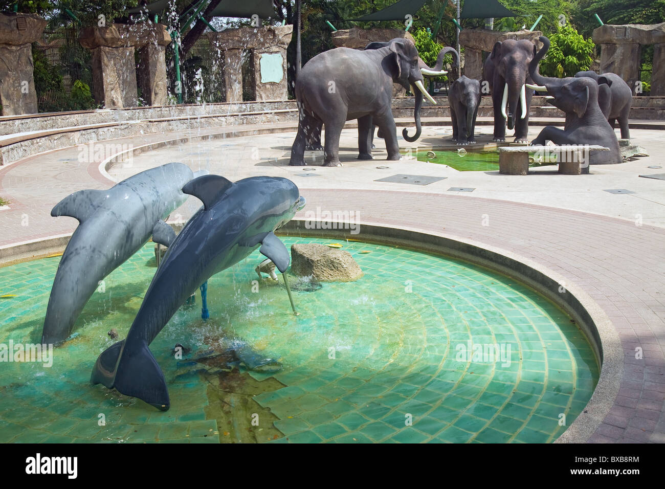 fountain with a dolphin and elephants Stock Photo - Alamy
