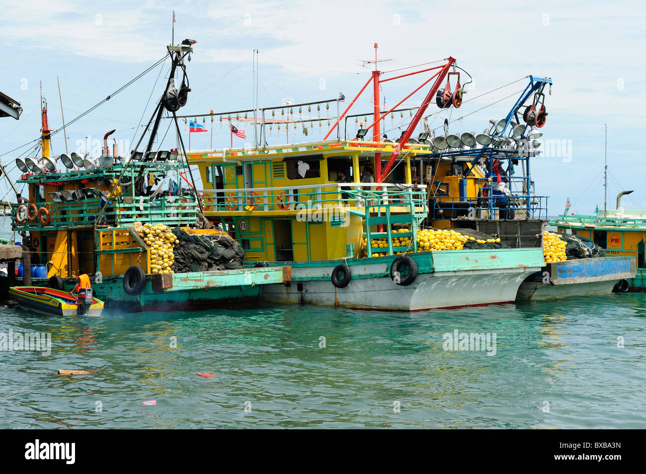 Fishing boats on waterfront in Kota Kinabalu, Sabah Stock Photo - Alamy