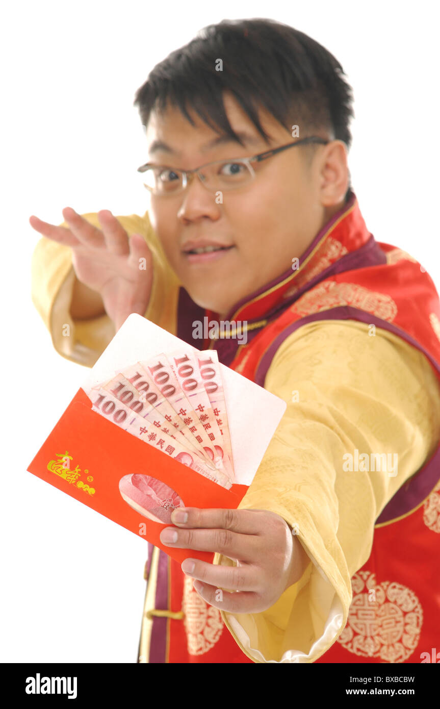 Man holding a red envelope of Chinese currency Stock Photo - Alamy
