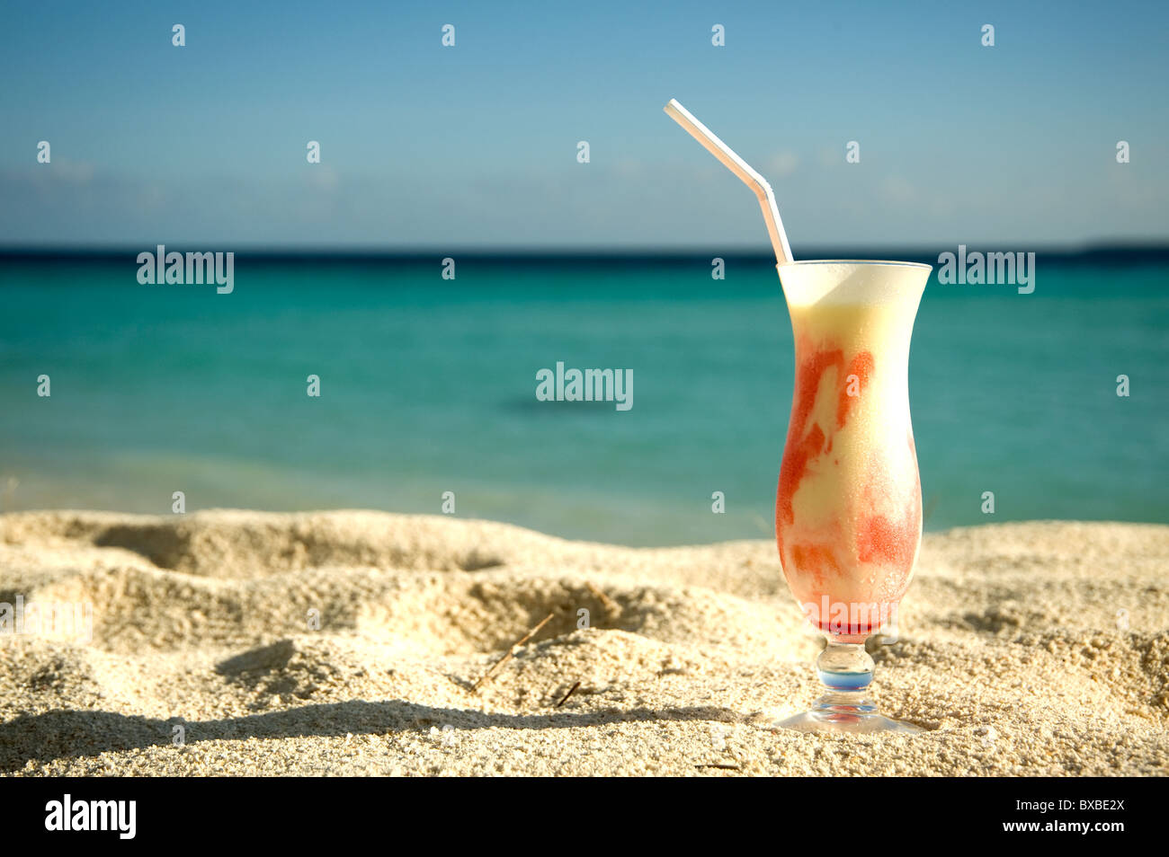 Milk and fruit cocktail on the sand Stock Photo - Alamy