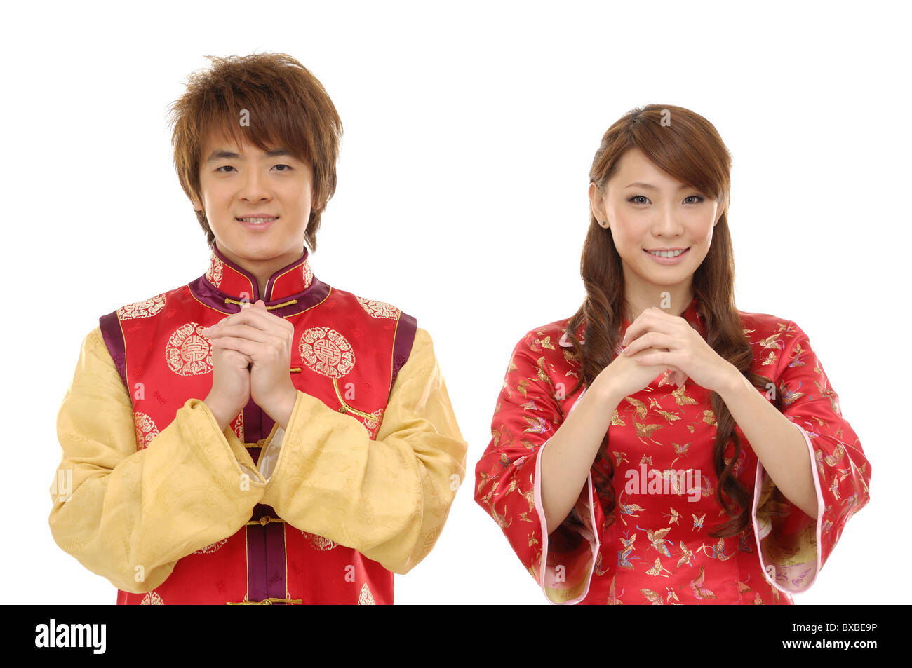 Portrait of a couple praying and smiling Stock Photo - Alamy