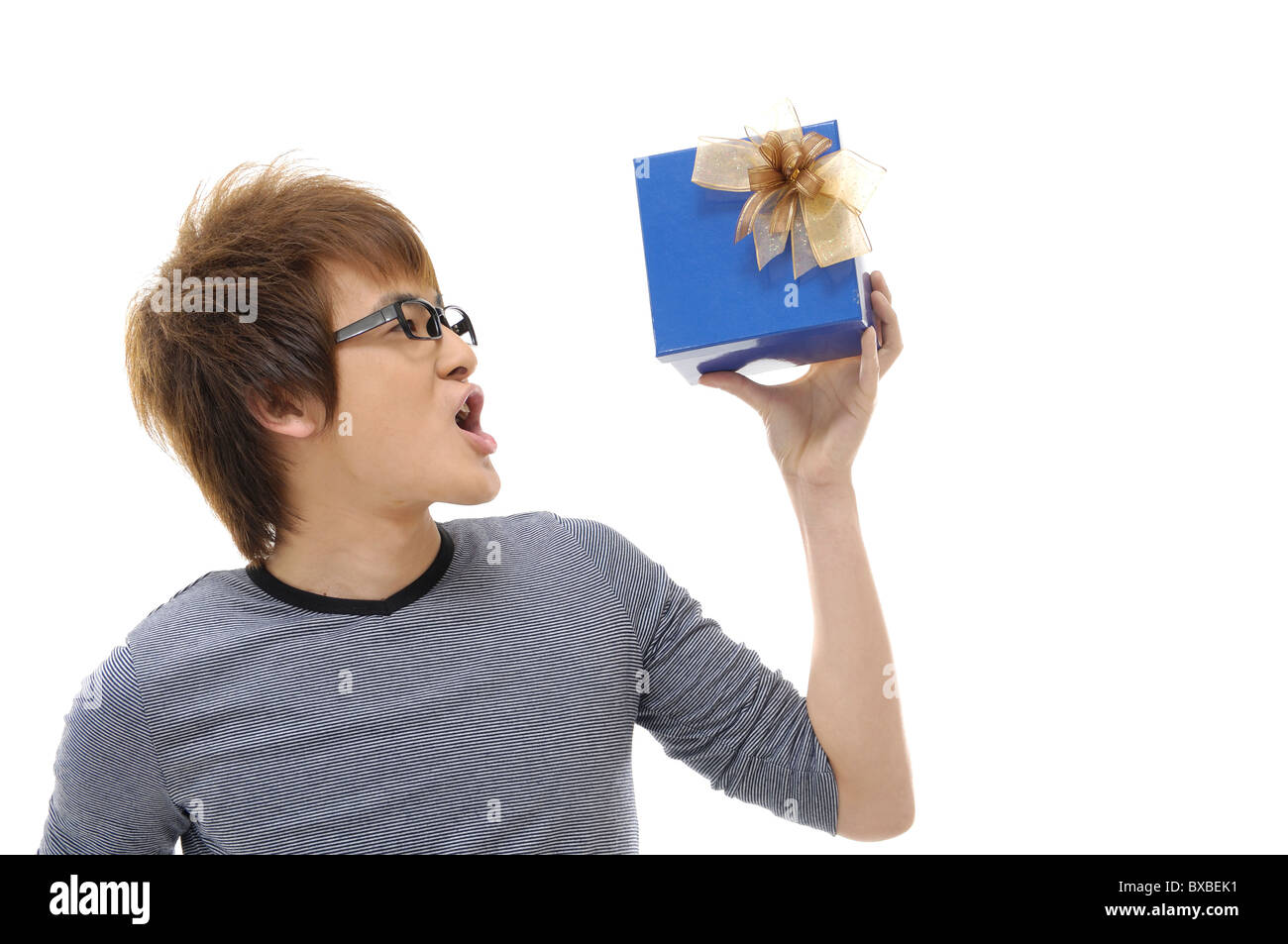 Man holding a gift and shouting Stock Photo - Alamy