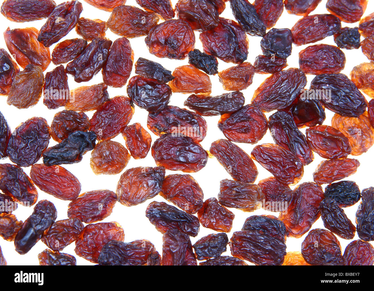 Closeup of raisins on white background Stock Photo - Alamy