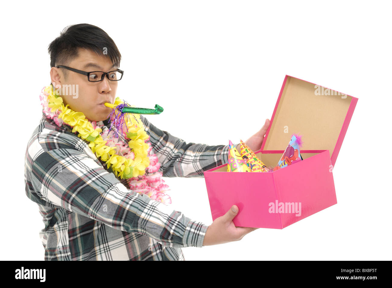 Man opening a gift box and looking surprised Stock Photo - Alamy