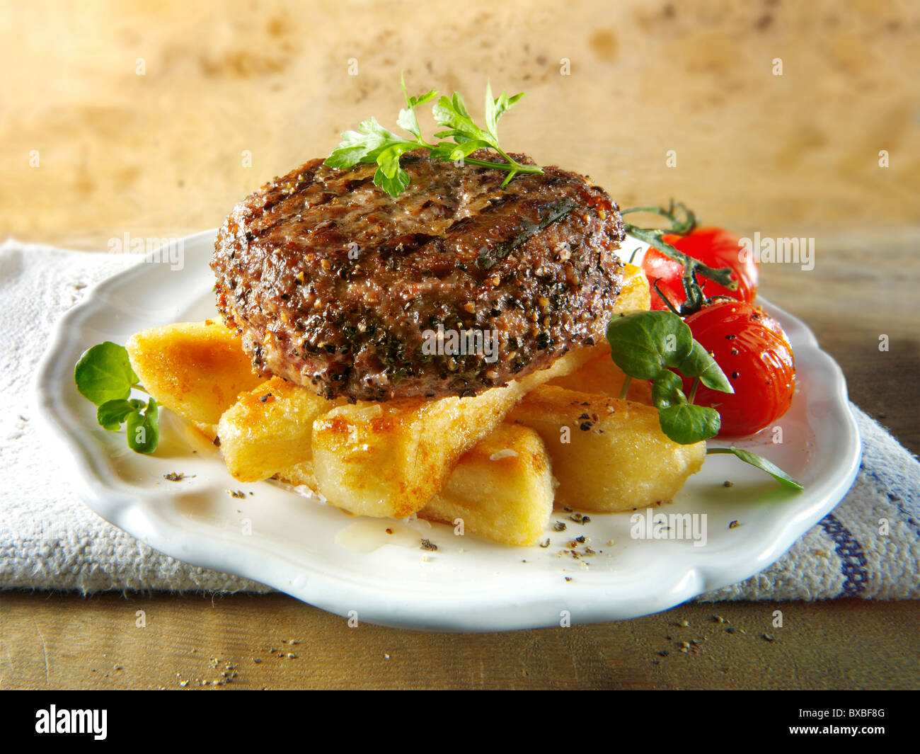 Peppered beef burger with chips Stock Photo - Alamy