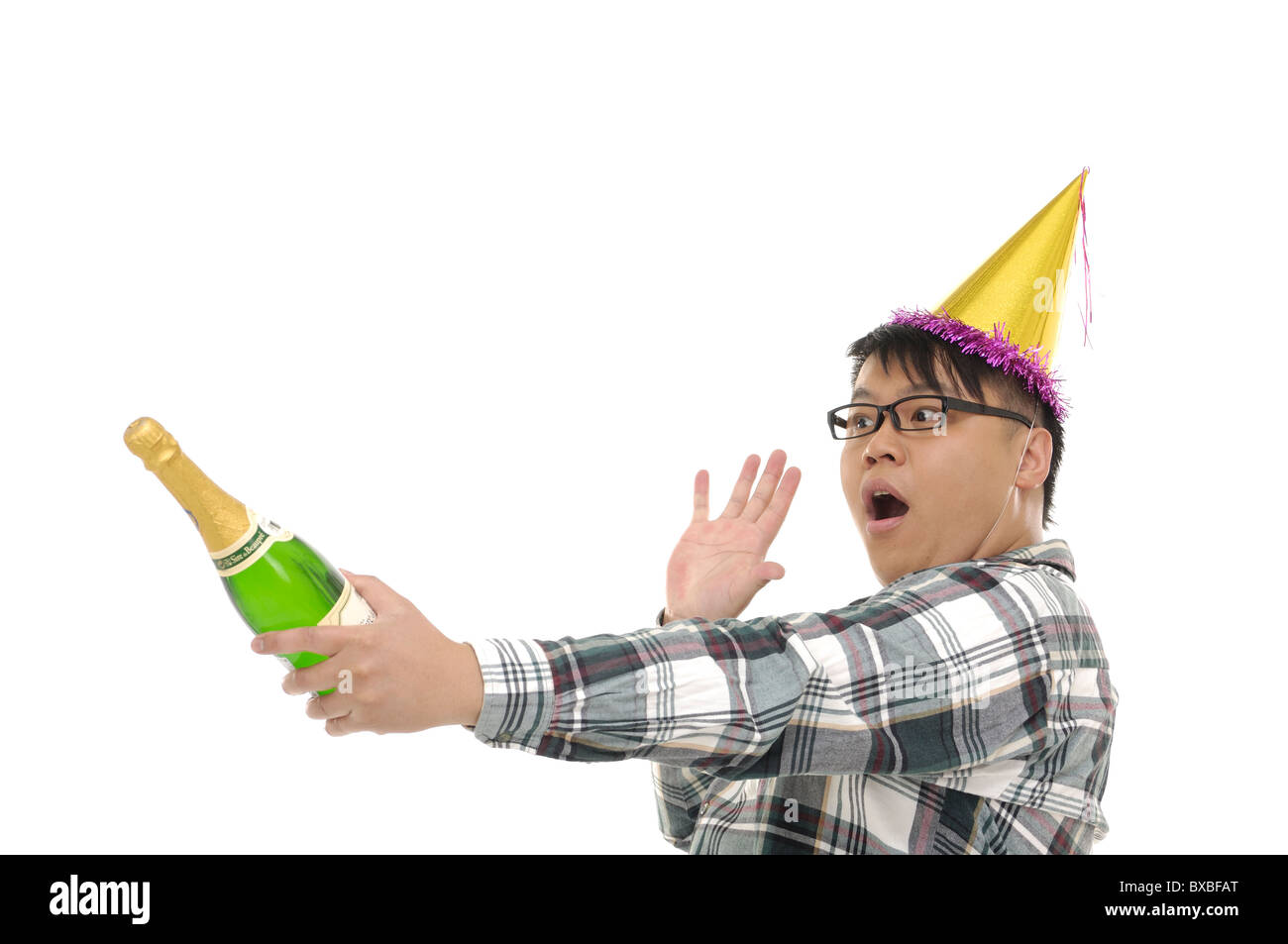Man opening a champagne bottle and looking surprised Stock Photo - Alamy