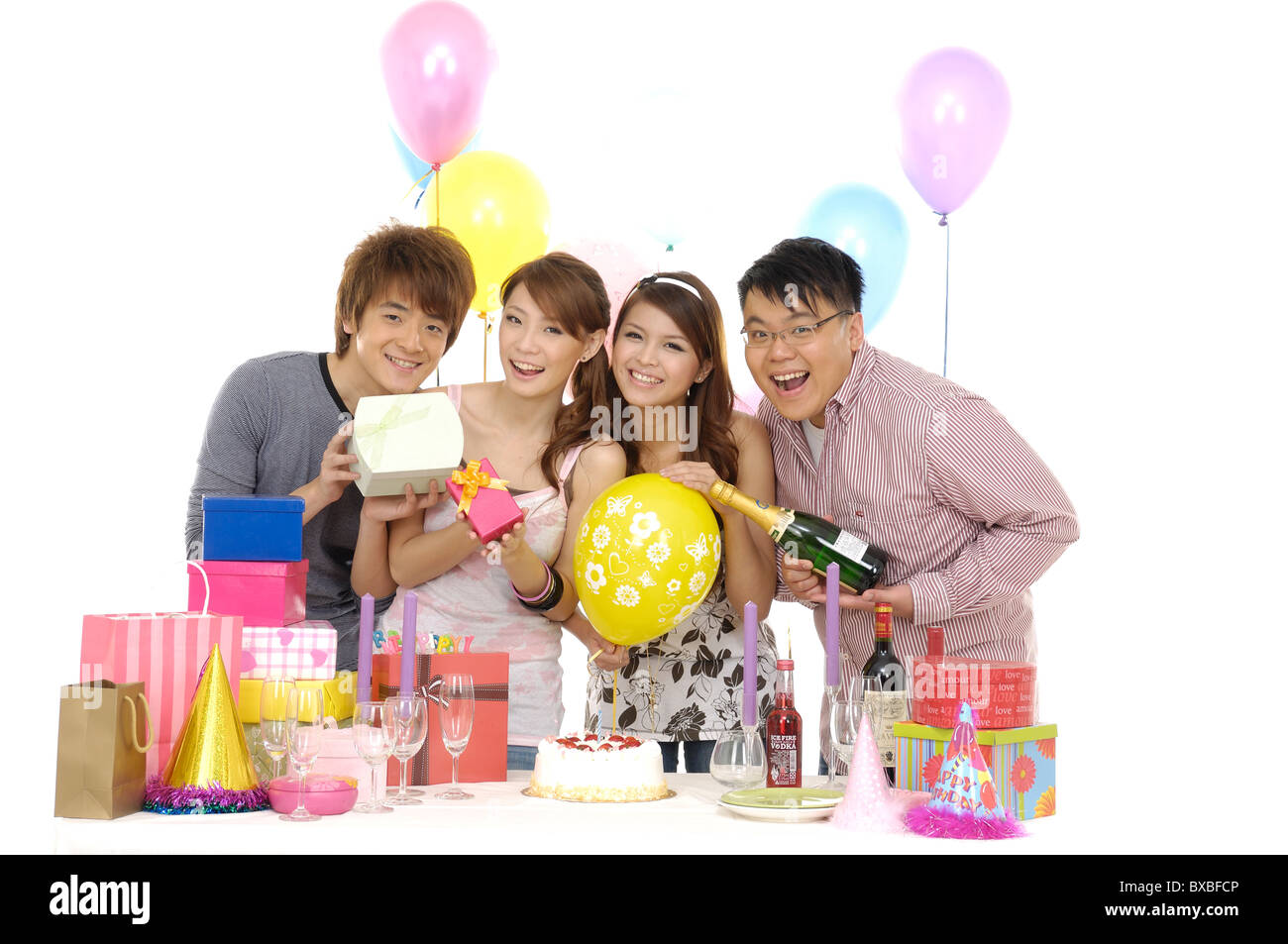 Friends celebrating a birthday party Stock Photo - Alamy