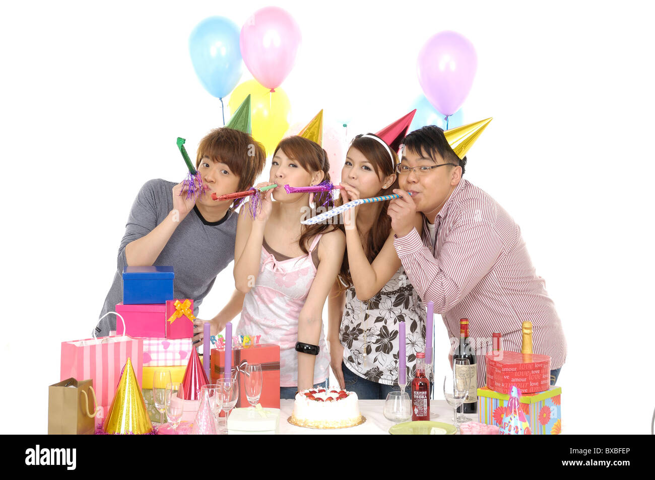 Friends celebrating a birthday party Stock Photo - Alamy