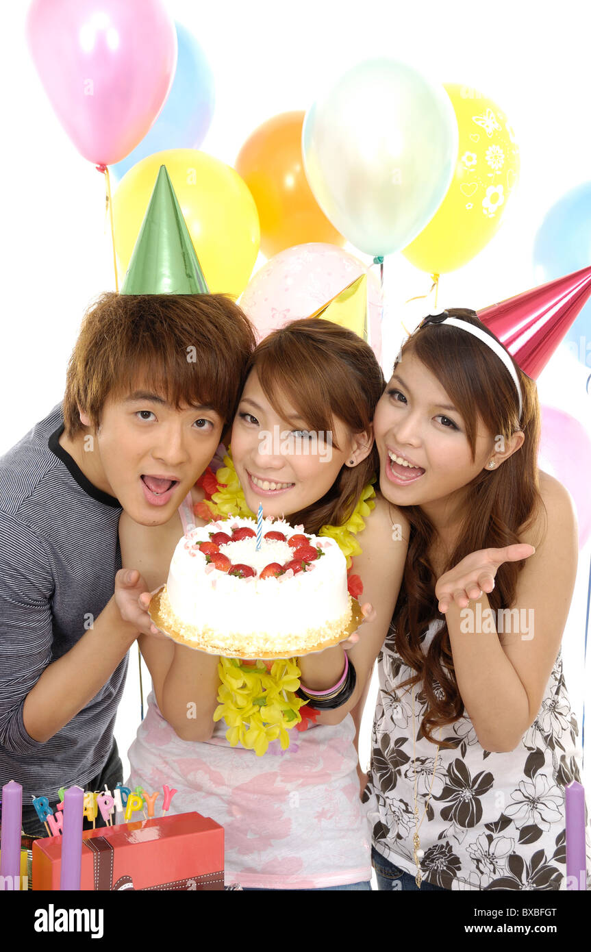 Friends celebrating a birthday party Stock Photo - Alamy