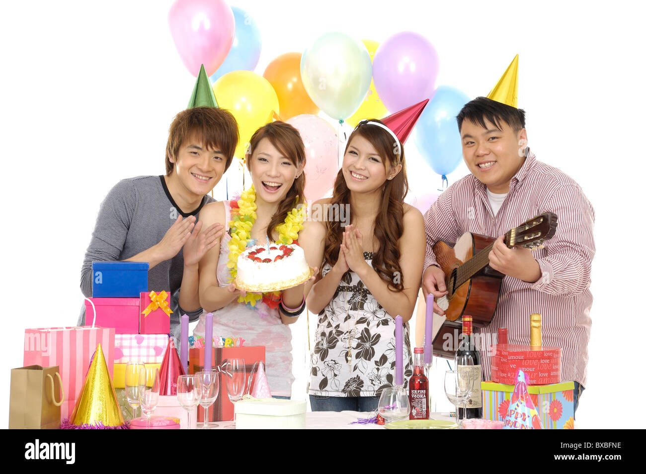 Friends celebrating a birthday party Stock Photo - Alamy