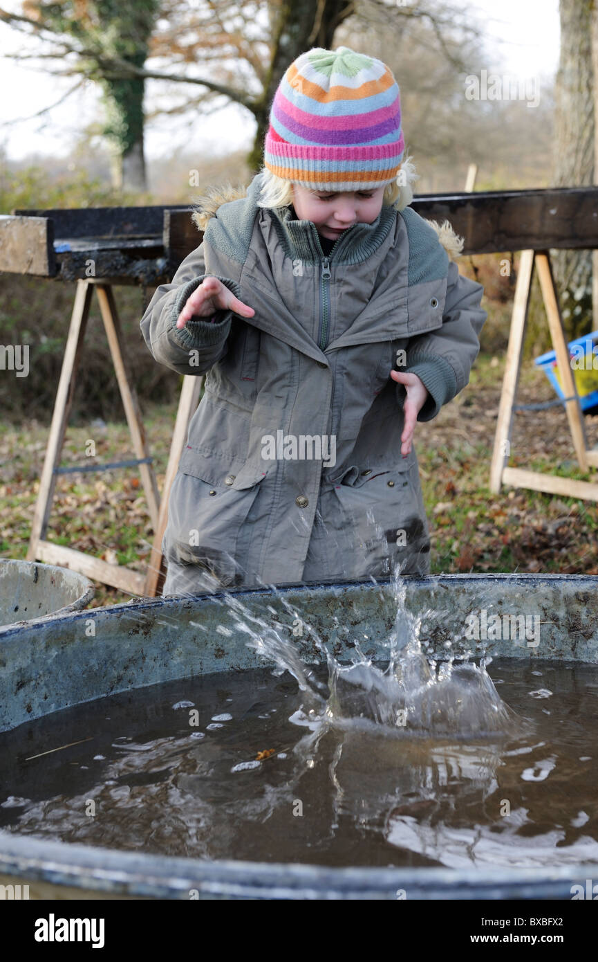 Child helping to sort the fish after the lake had been emptied and ...