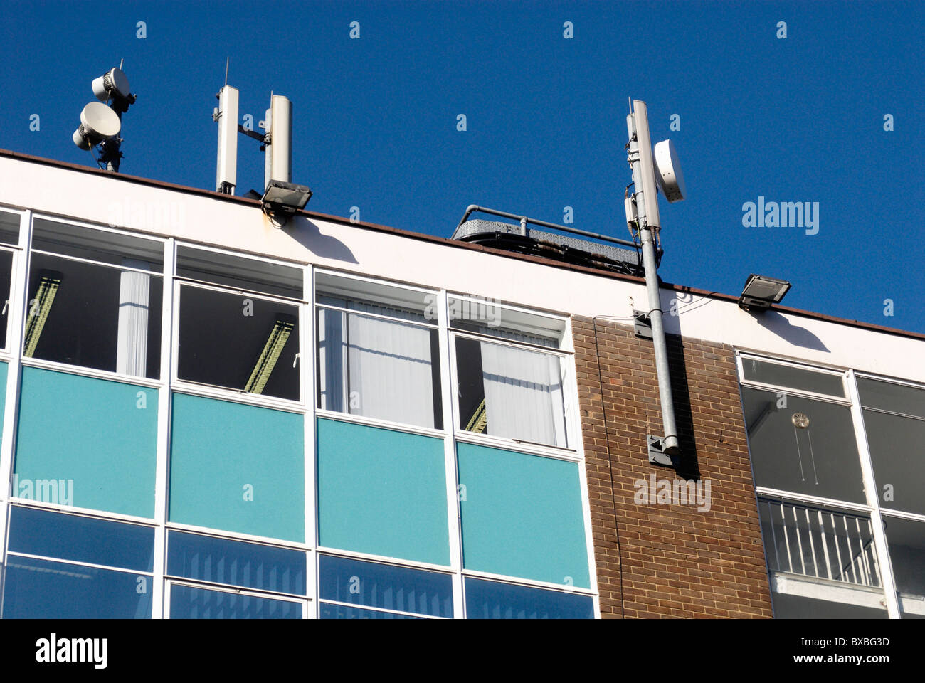 1960's office block with mobile phone masts on it's roof London UK ...