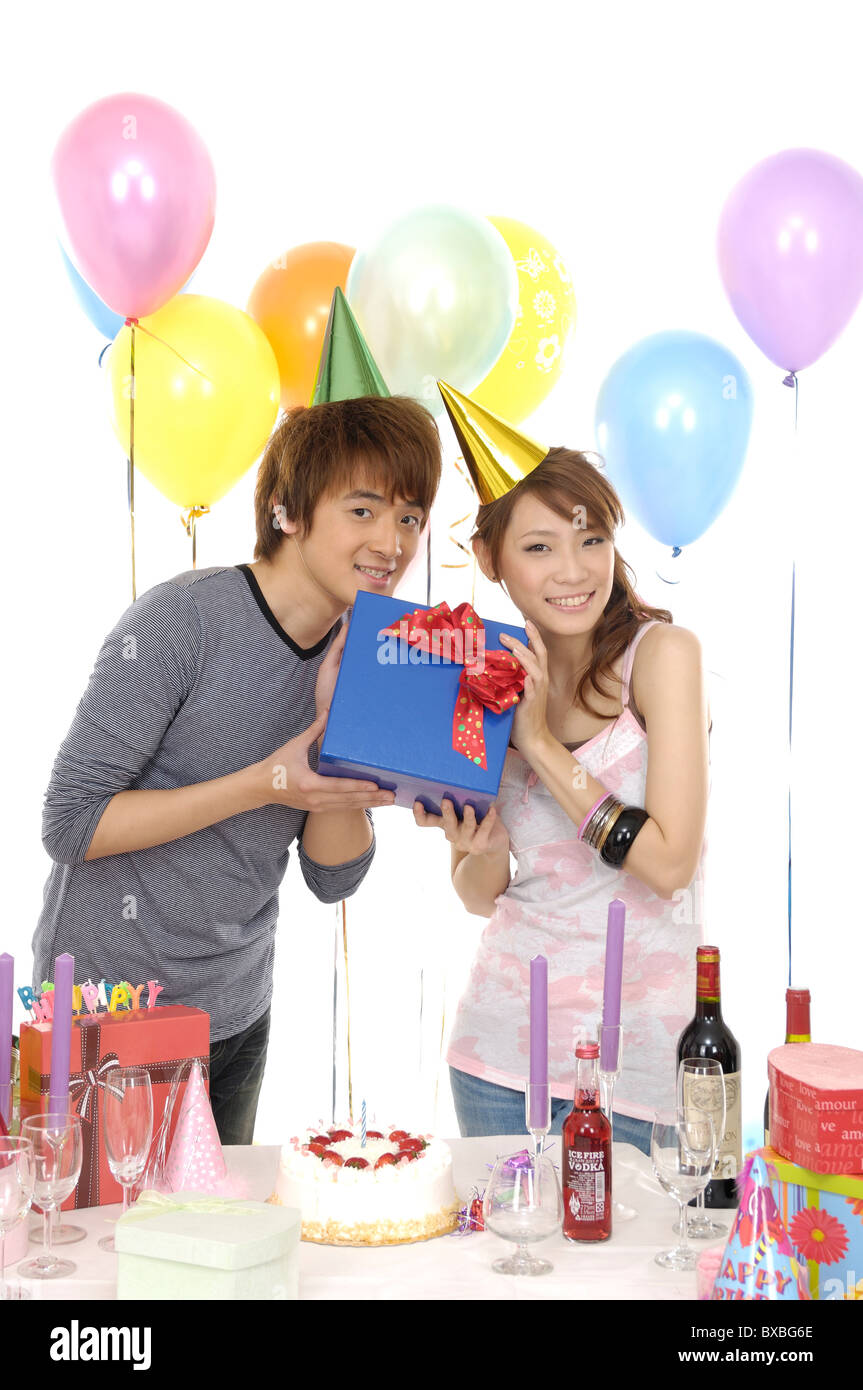 Friends celebrating a birthday party Stock Photo - Alamy