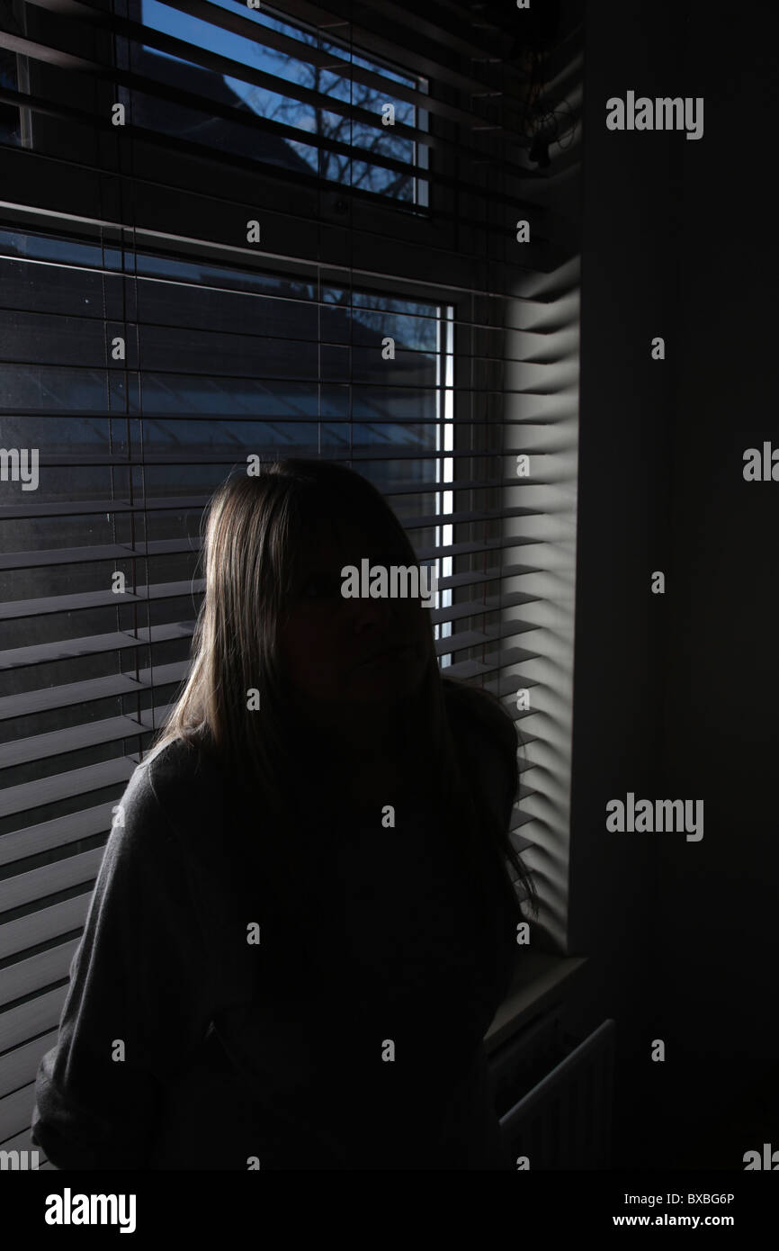 Shadowy figure woman breaking in hi-res stock photography and images ...