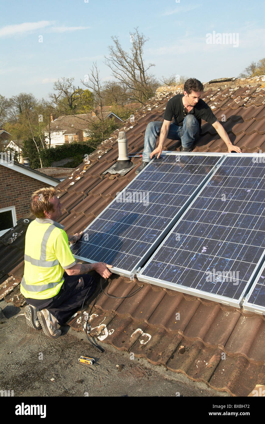 Men fitting solar panel panels power roof hi-res stock photography and ...